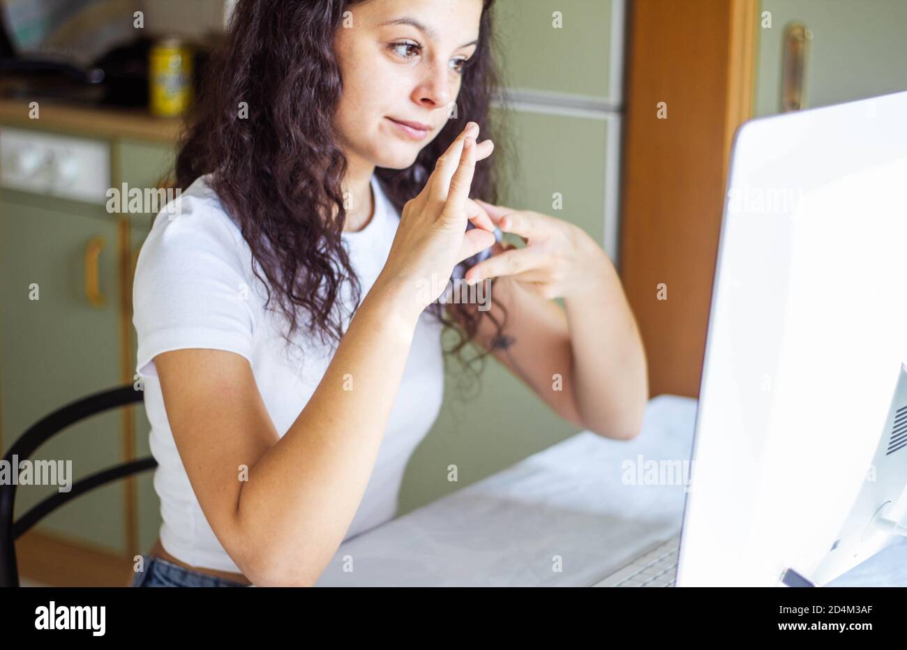 girl speaking sign language on video call Stock Photo - Alamy