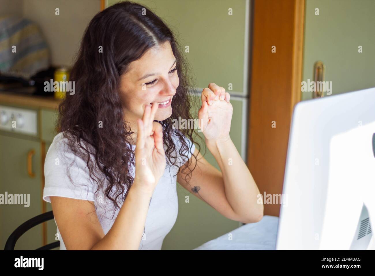 girl speaking sign language on video call Stock Photo - Alamy
