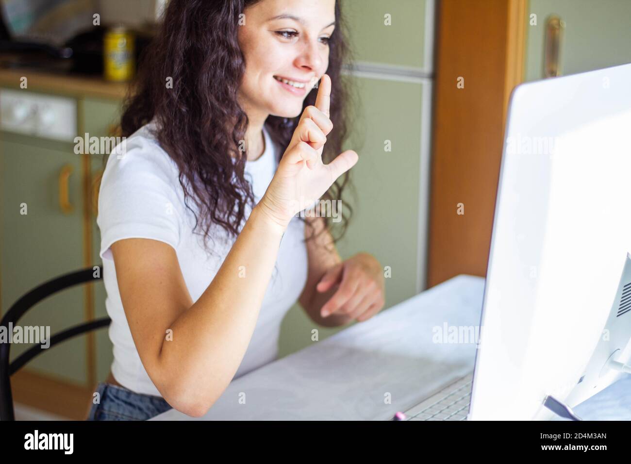 girl speaking sign language on video call Stock Photo - Alamy