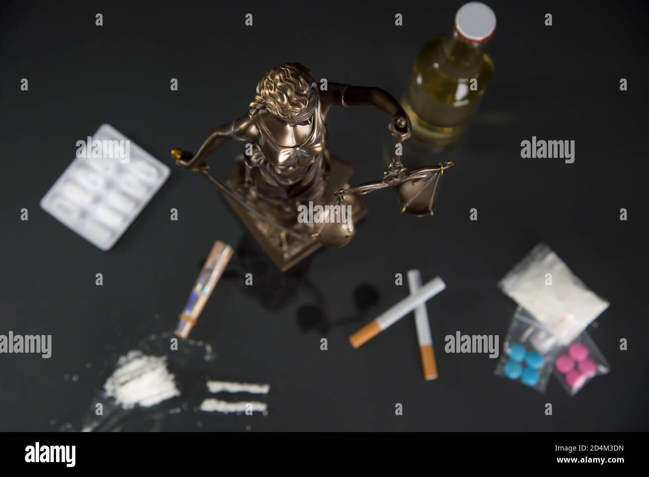 Legal and illegal intoxicants - Justitia statue in the midst of ...