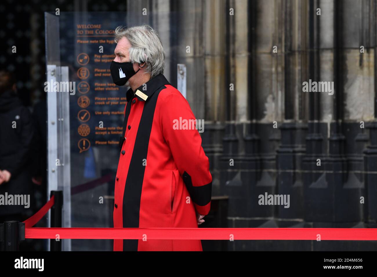 Cologne, Germany, 2020. Cologne Cathedral guide wearing face mask ...