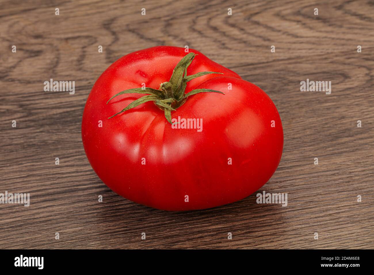 Ripe tasty red big tomato over background Stock Photo - Alamy