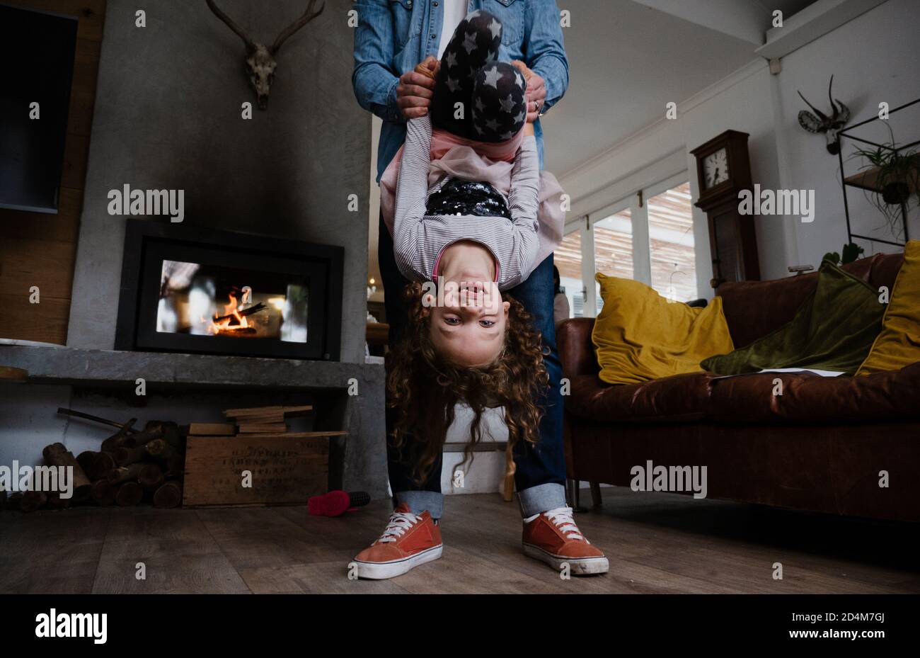 Father holding child upside down hi-res stock photography and images - Alamy