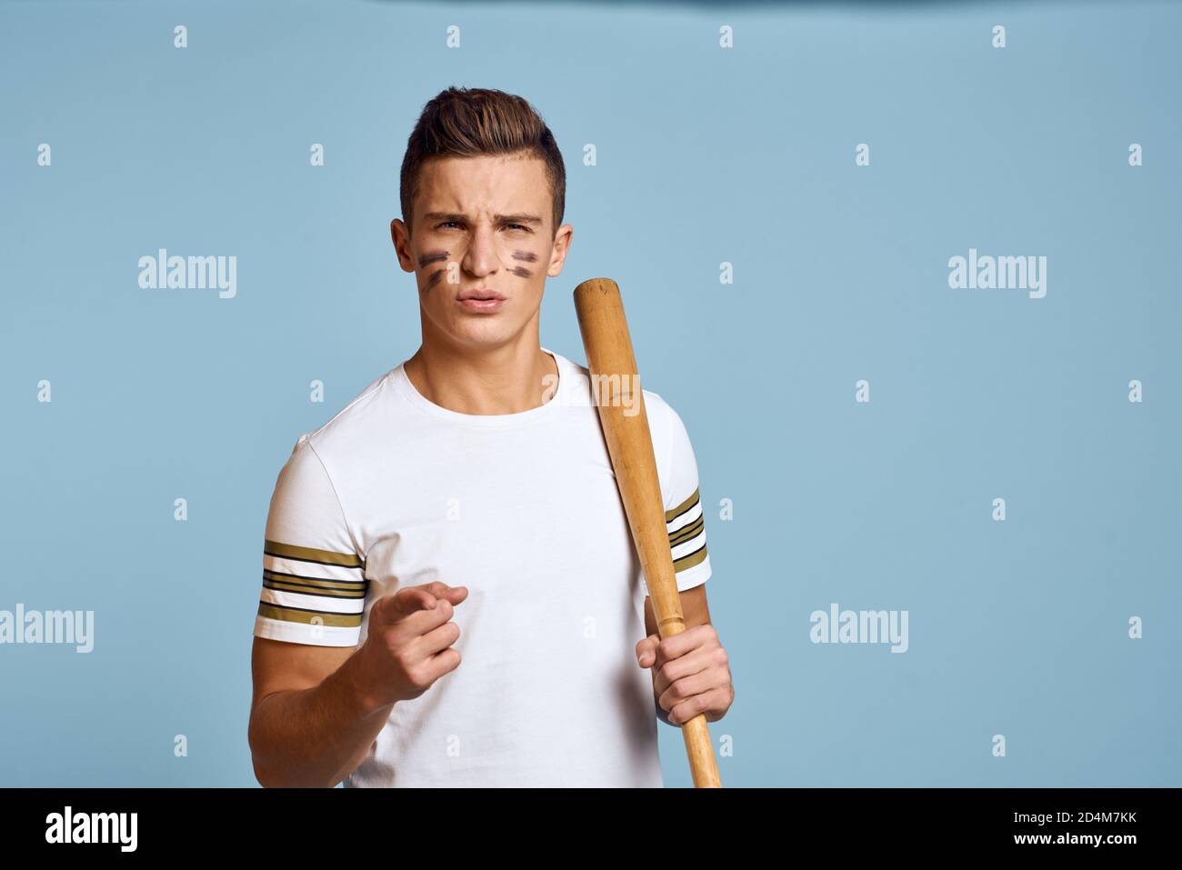 baseball guy with a bat in his hand on a blue background and a combat ...