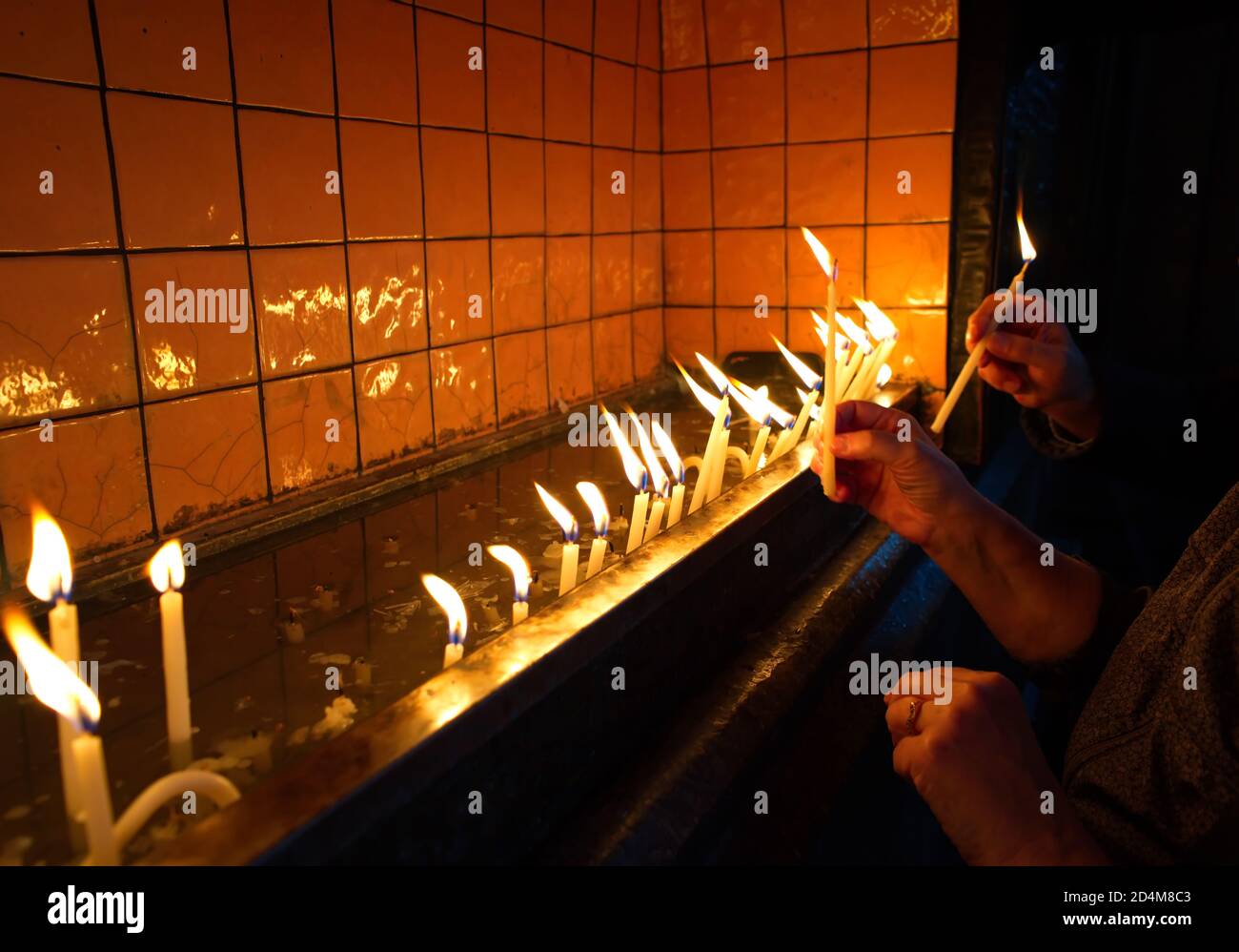 burning the candle at church. candle burning ritual, sacrament ...