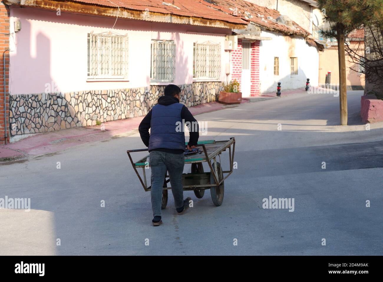 street vendor. junk dealer. junkman. he wanders the streets collecting ...