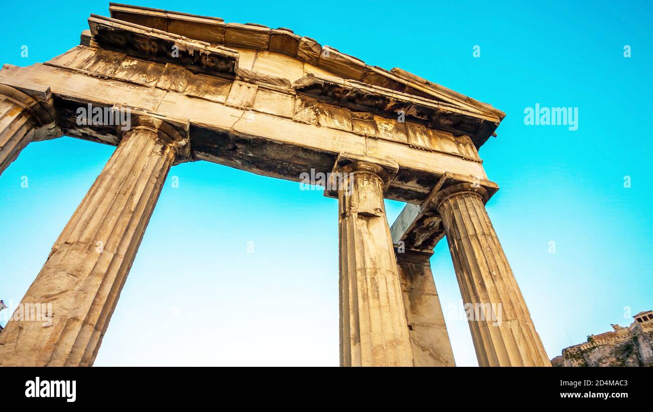 Ancient Greek temple columns against the clear blue sky, low angle view ...