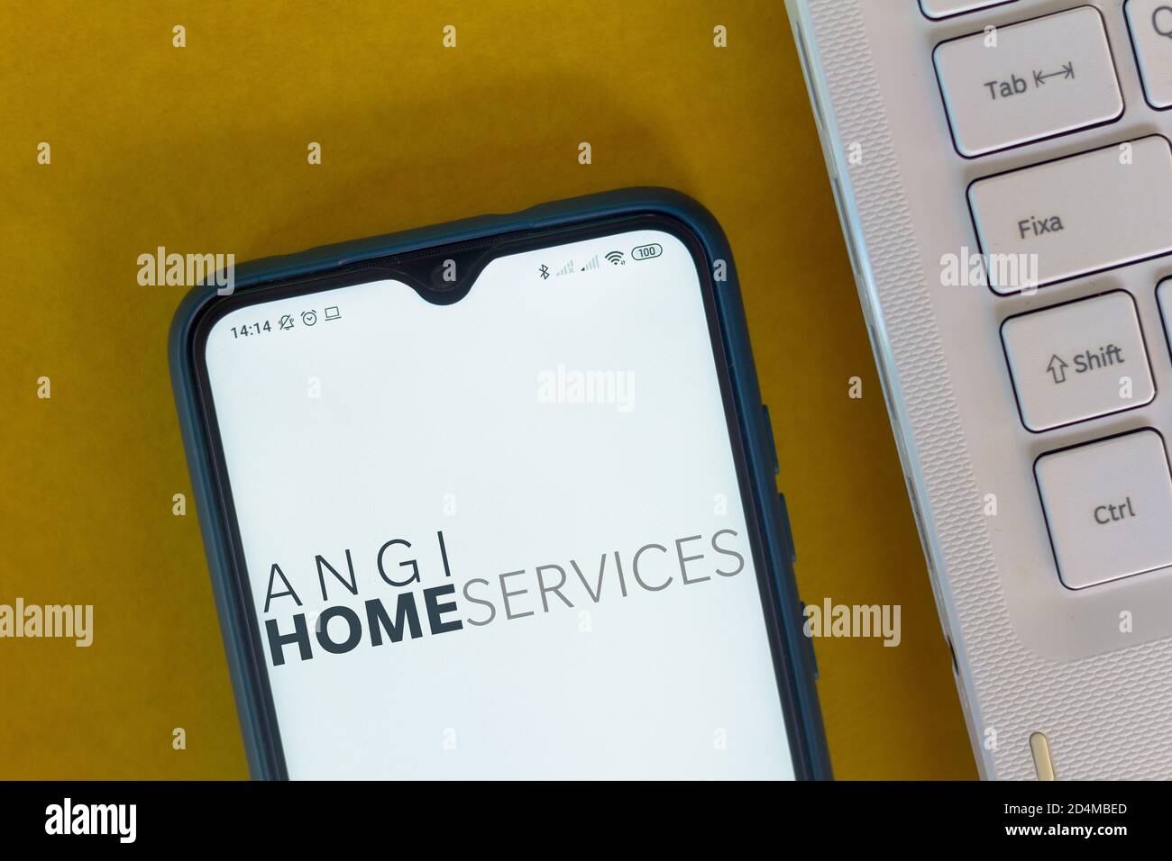 In this photo illustration the ANGI Homeservices logo seen displayed on ...