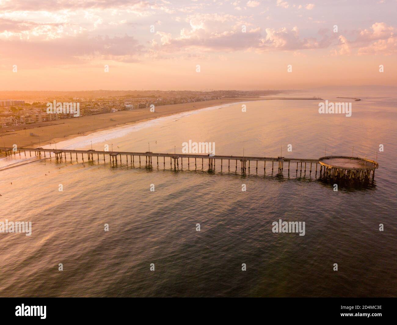 Venice Beach Pier surrounded by buildings during the sunset in Los ...