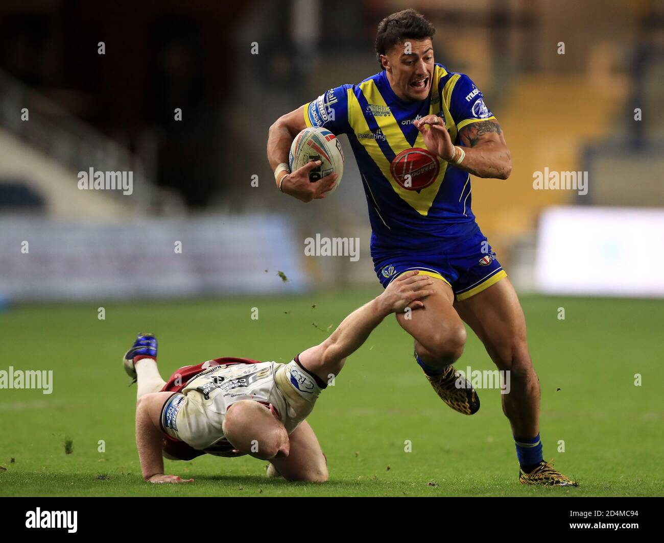 Warrington Wolves' Anthony Gelling goes passed Wigan Warriors' Liam Farrell during the Betfred ...