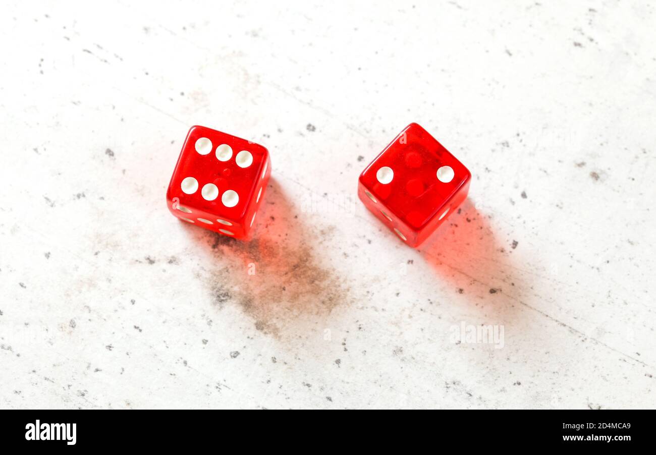 Two red craps dices showing Easy Eight (number 6 and 2) overhead shot ...