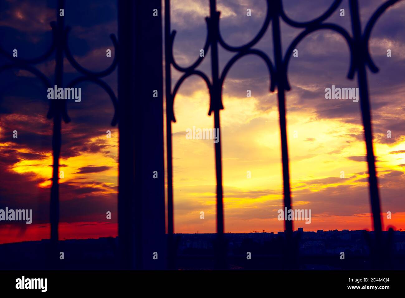 Awesome sunset through the barred window Stock Photo - Alamy