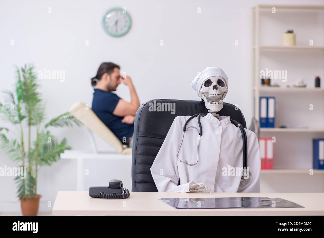 Young man visiting dead doctor in hospital Stock Photo - Alamy