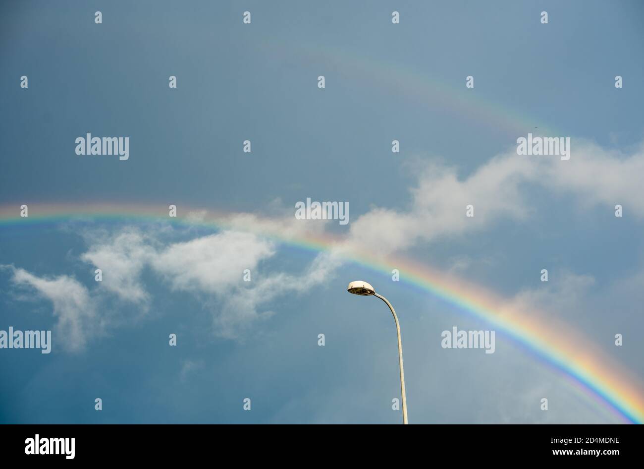 Street lamp with rainbow and clouds above Stock Photo - Alamy