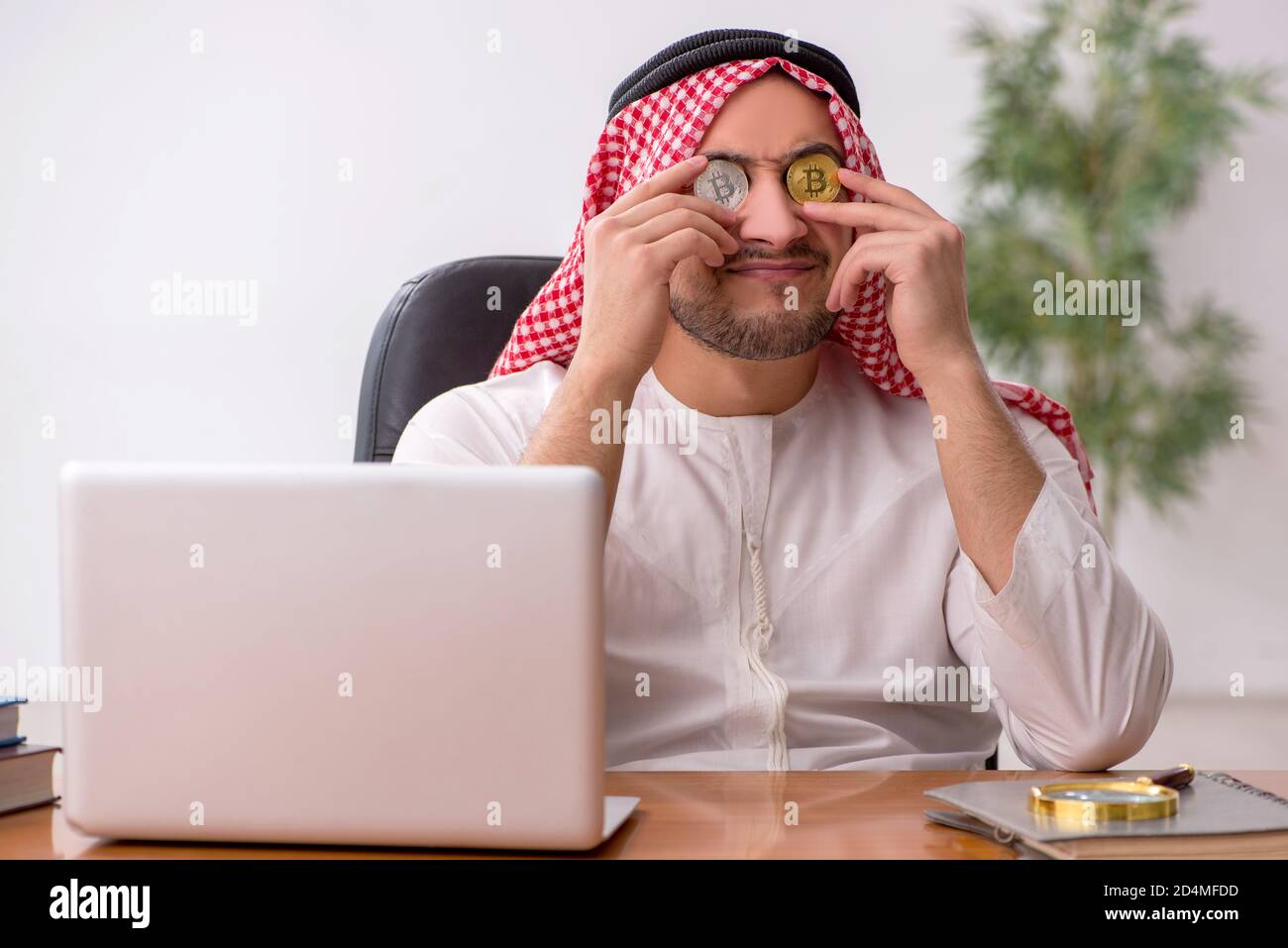 Male arab employee working in the office Stock Photo - Alamy