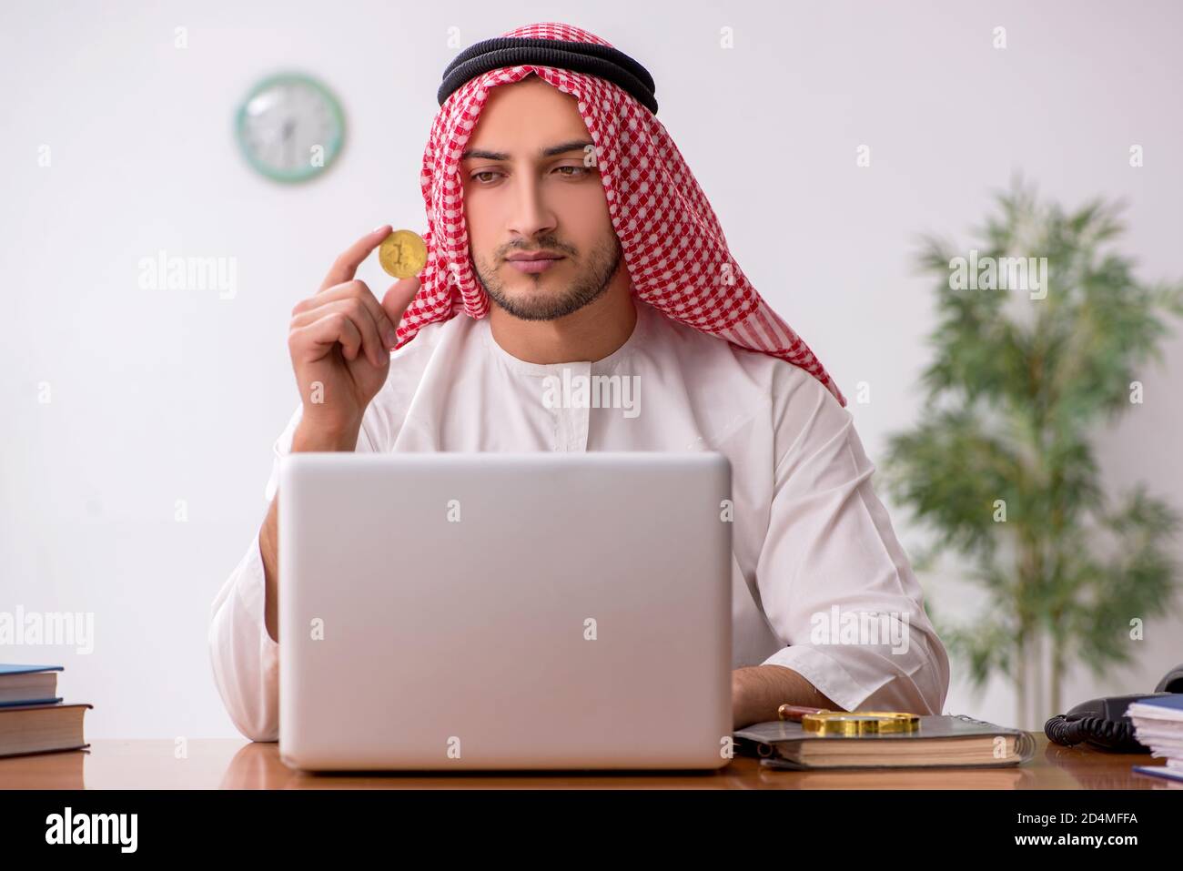 Male arab employee working in the office Stock Photo - Alamy