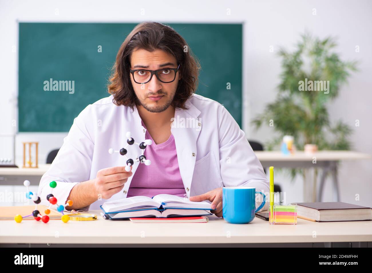 Young physicist in the classroom Stock Photo - Alamy