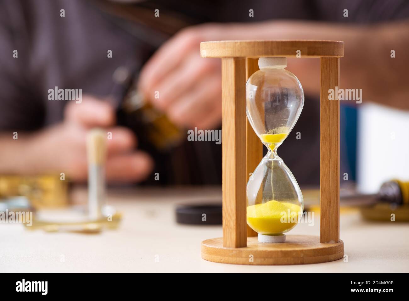 Old watchmaker working in the workshop Stock Photo - Alamy