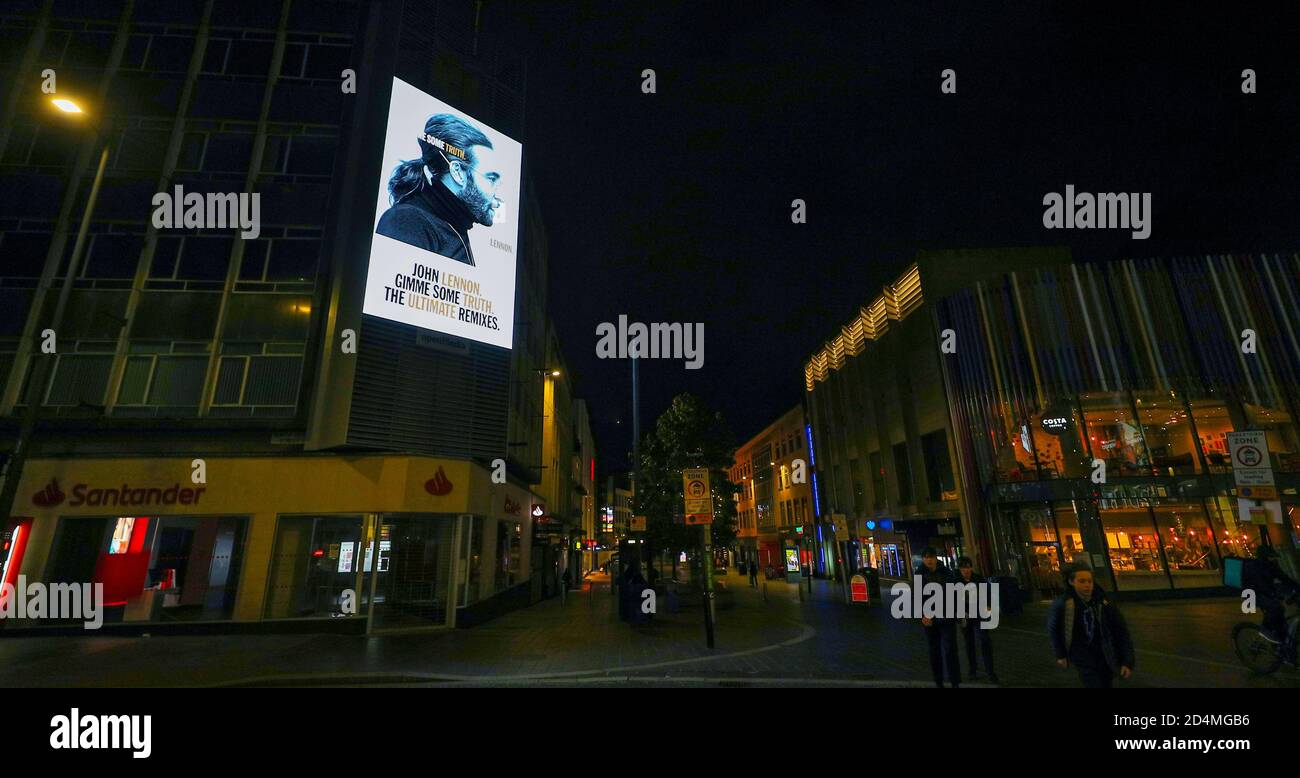 A digital advert of John Lennon in Mathew Street, Liverpool, on what ...