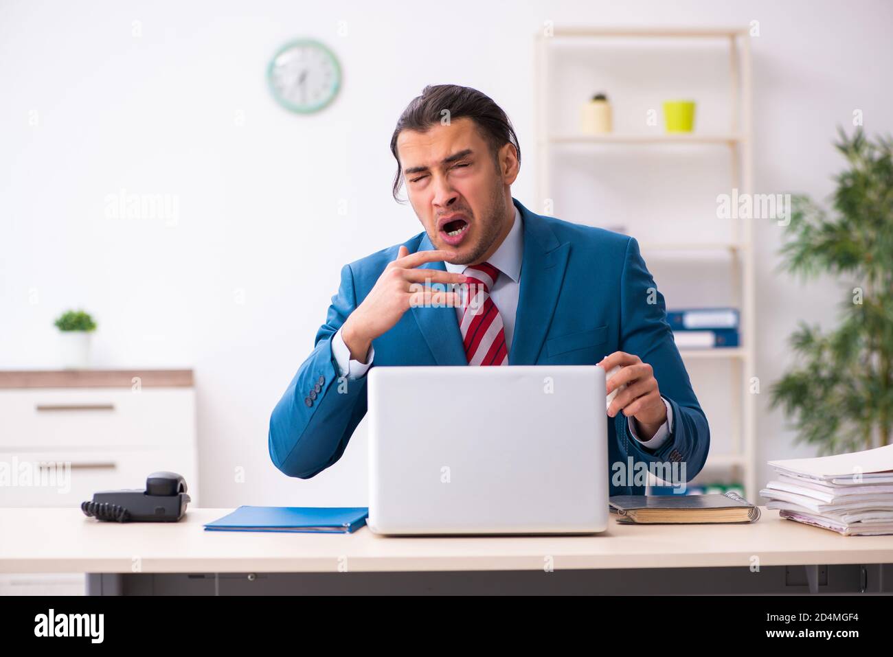 Sick employee suffering at workplace from covid-19 Stock Photo - Alamy