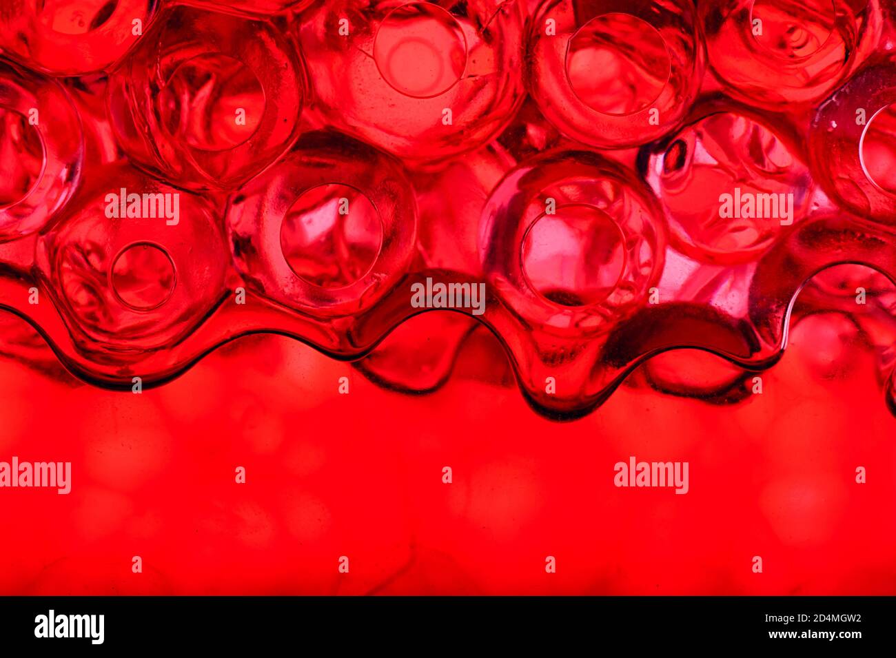 Background made of red gel water pearls Stock Photo - Alamy