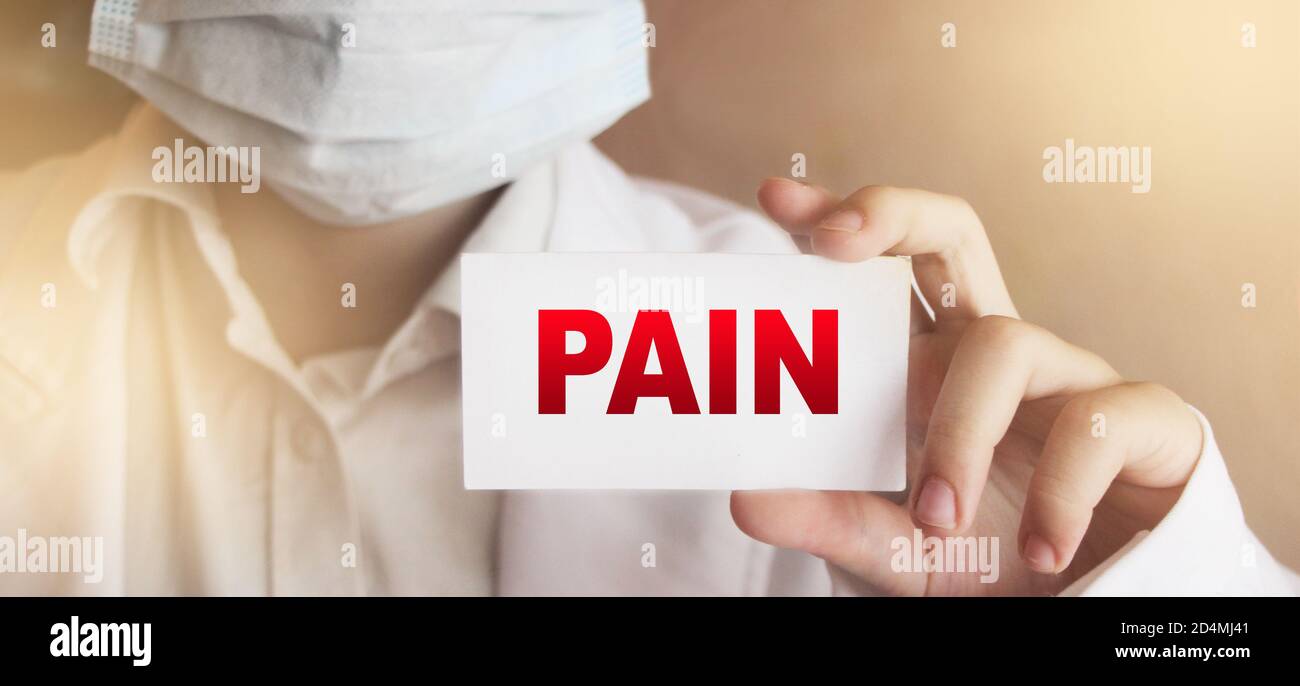 Pain card in hand of Medical Doctor. Healthcare pain relief concept ...