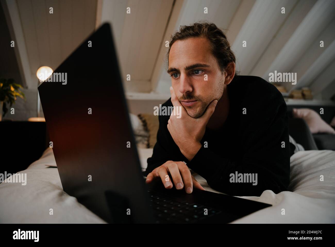 Young caucasian male student working from home and his laptop Stock ...