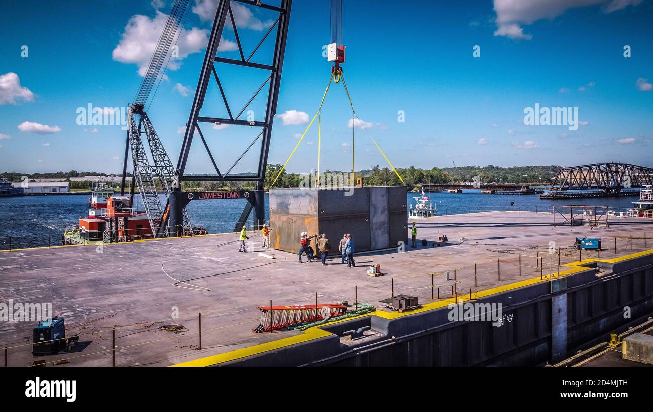 A propulsion engine for the U.S. Coast Guard Cutter Healy is craned ...