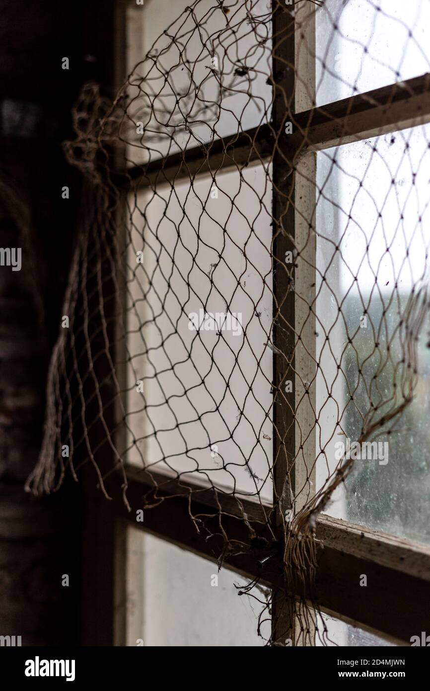 Fishing net on the window Stock Photo - Alamy