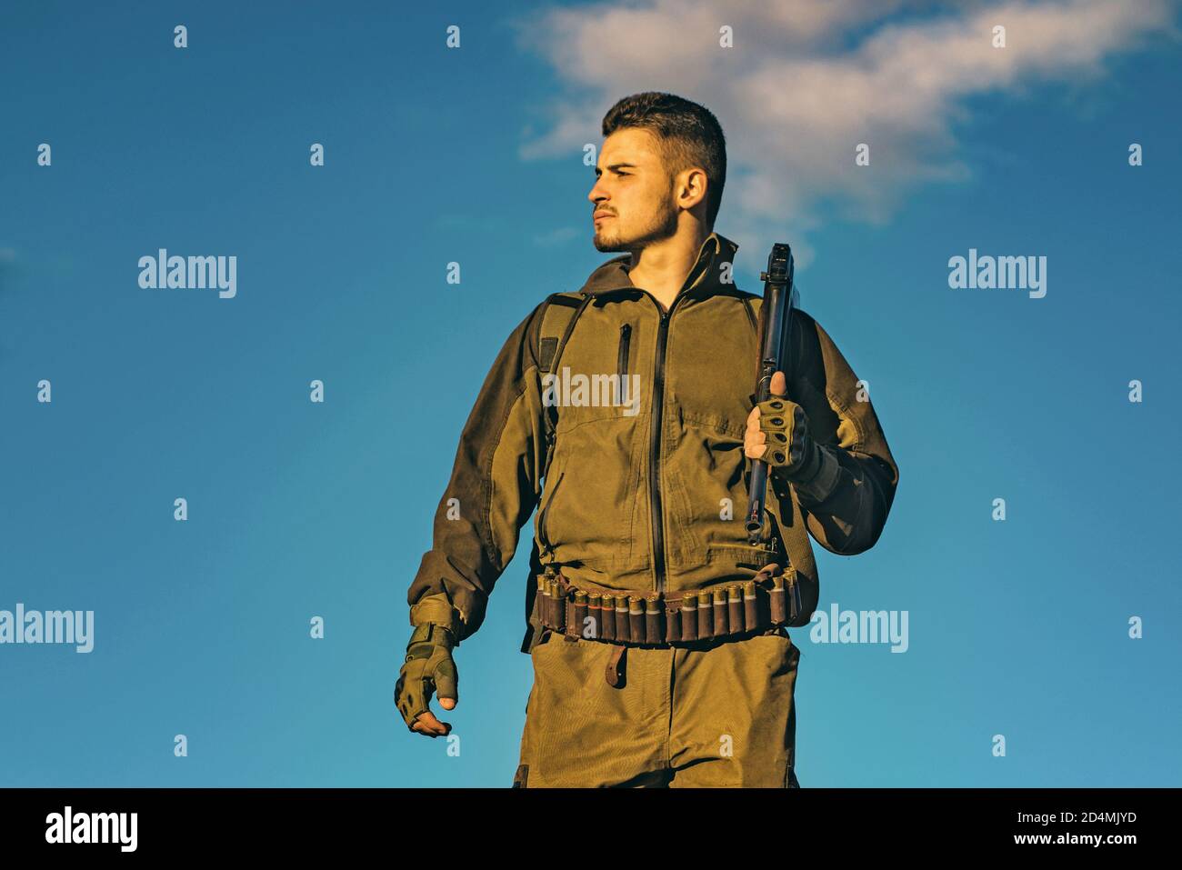 Hunter with shotgun gun on hunt. Hunter in the fall hunting season ...