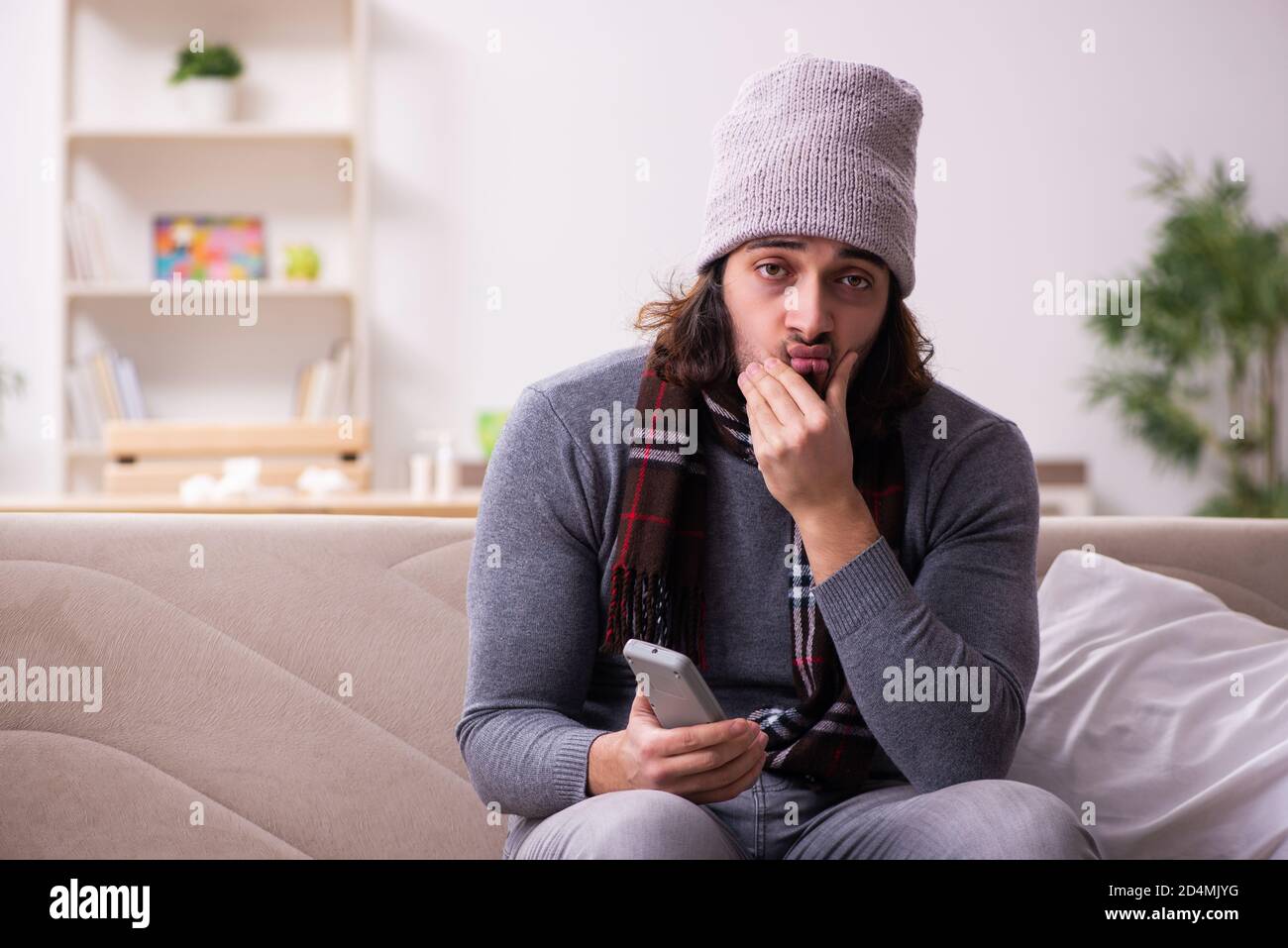 Young man suffering at the home Stock Photo - Alamy