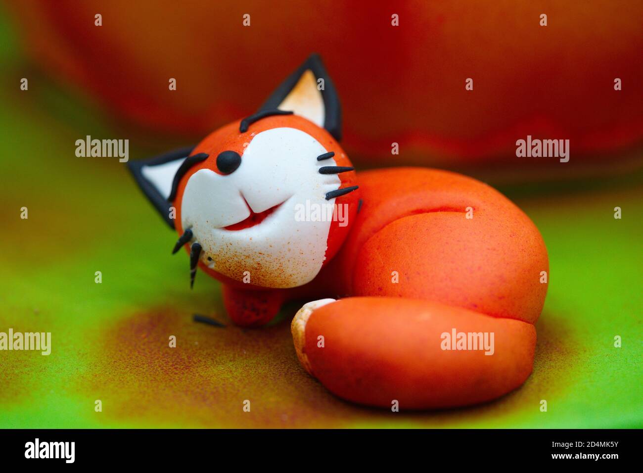 Fox figures made of sugar dough. delicious orange-colored confections ...