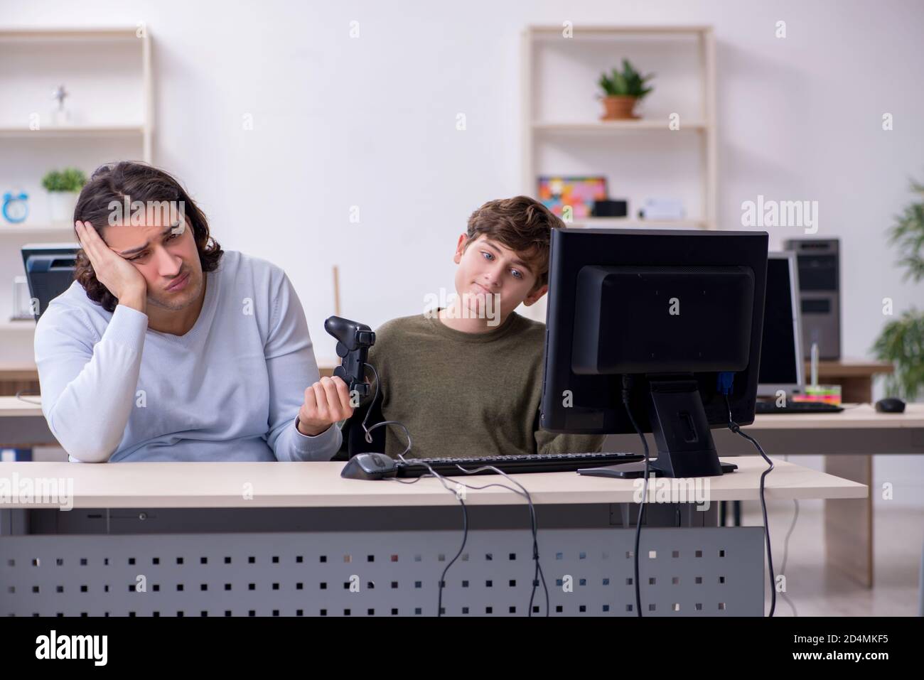 Father and son playing the computer games Stock Photo - Alamy