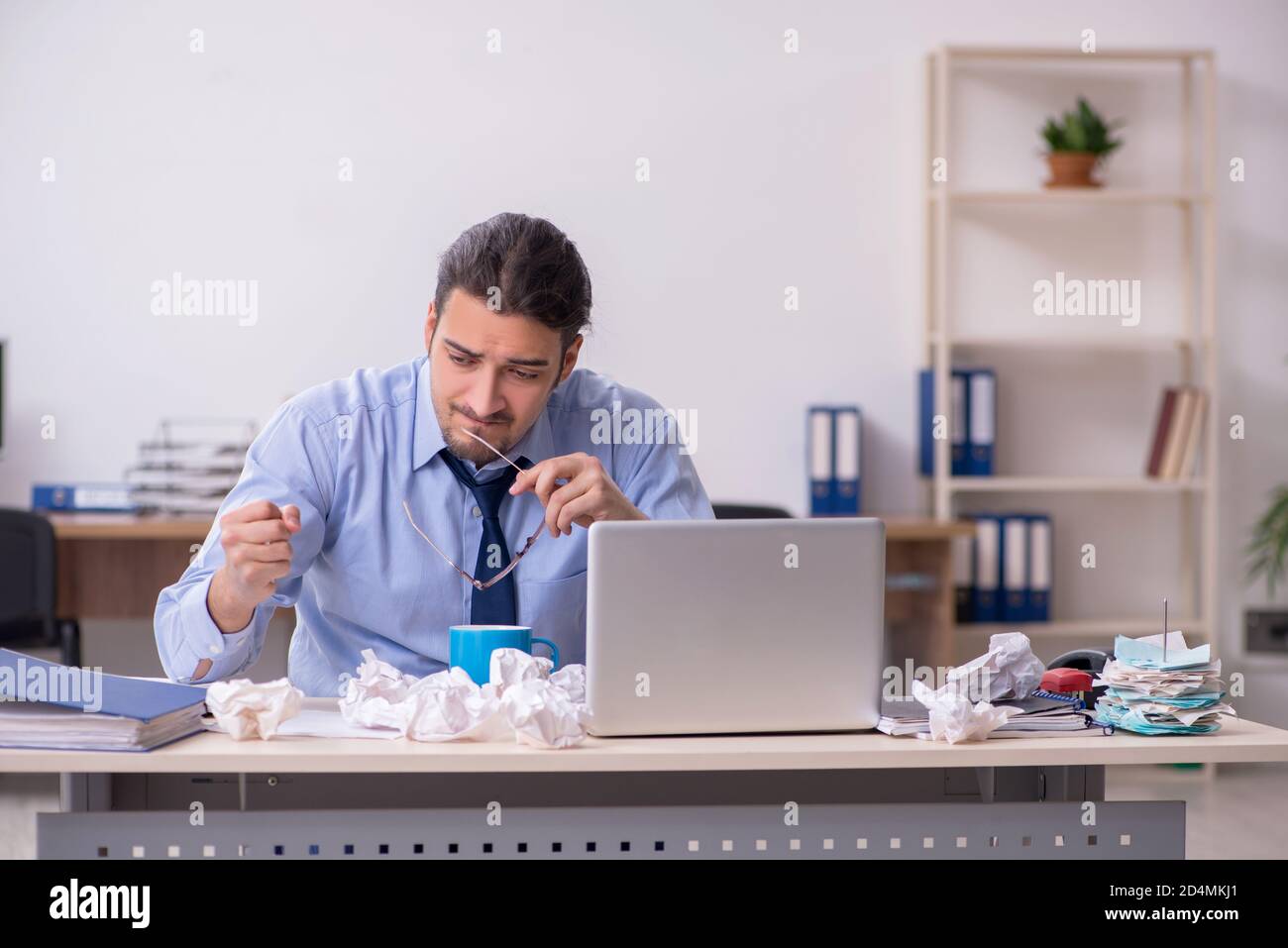 Sick male employee suffering at the workplace Stock Photo - Alamy