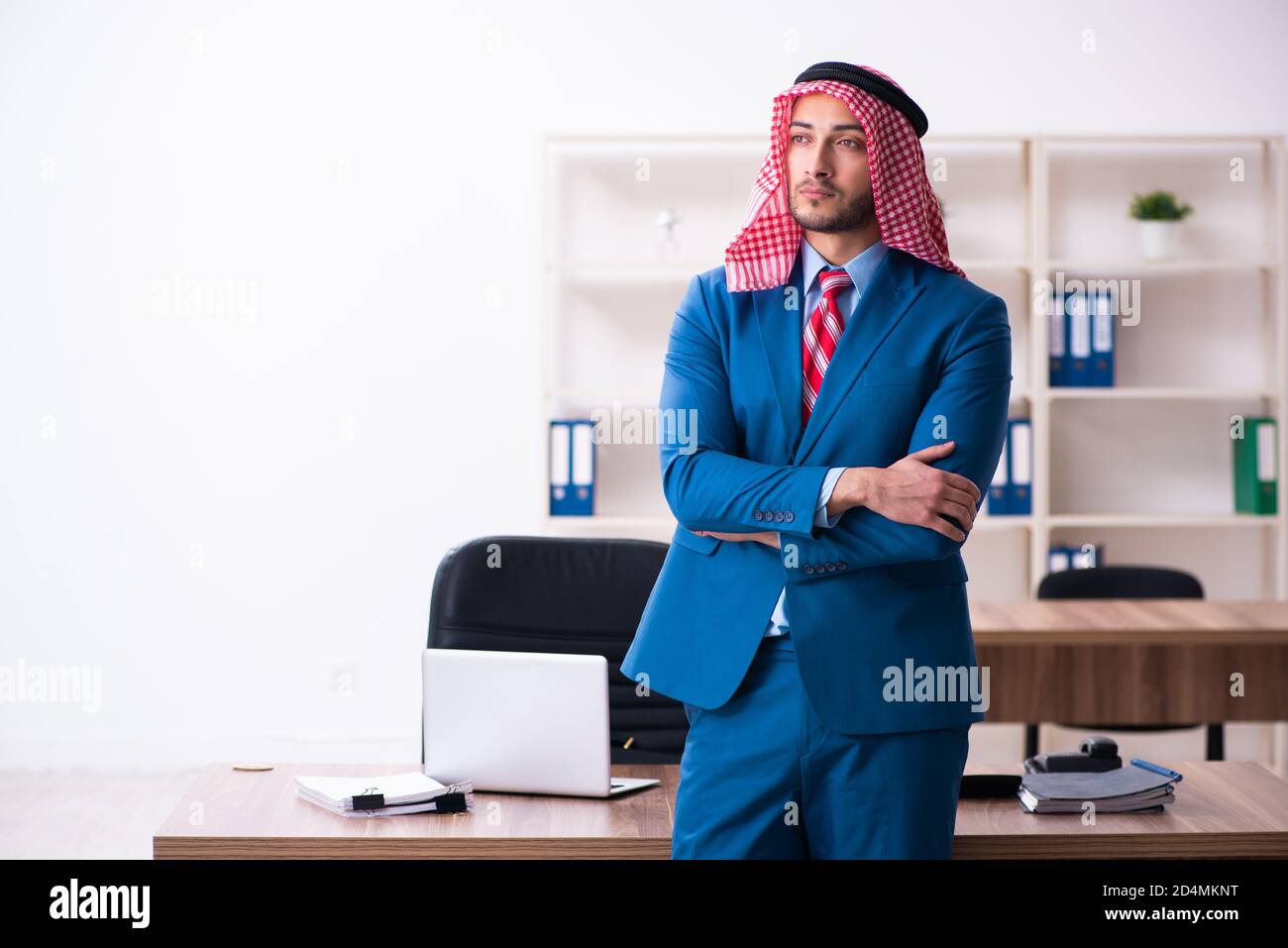 Young male arab employee working in the office Stock Photo - Alamy
