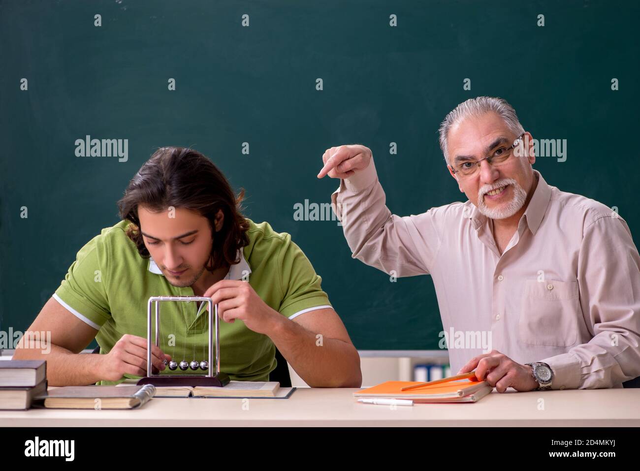 Old professor physicist and student in the classroom Stock Photo - Alamy