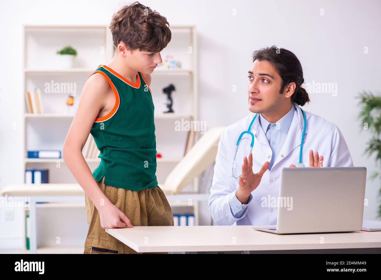 Sick boy visiting young doctor pediatrician Stock Photo - Alamy