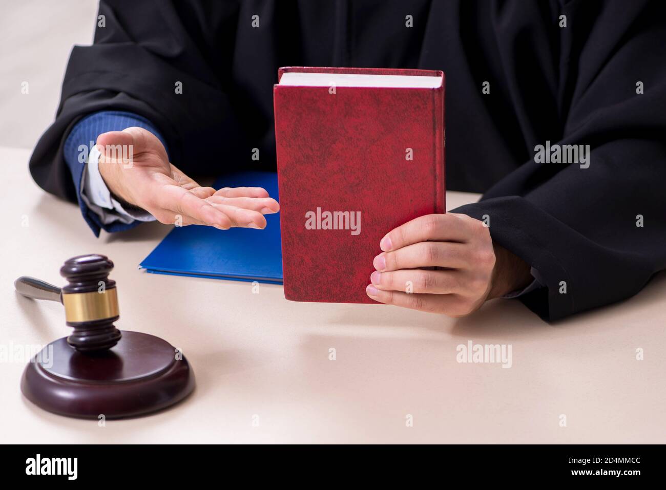 Young judge working in courthouse Stock Photo - Alamy