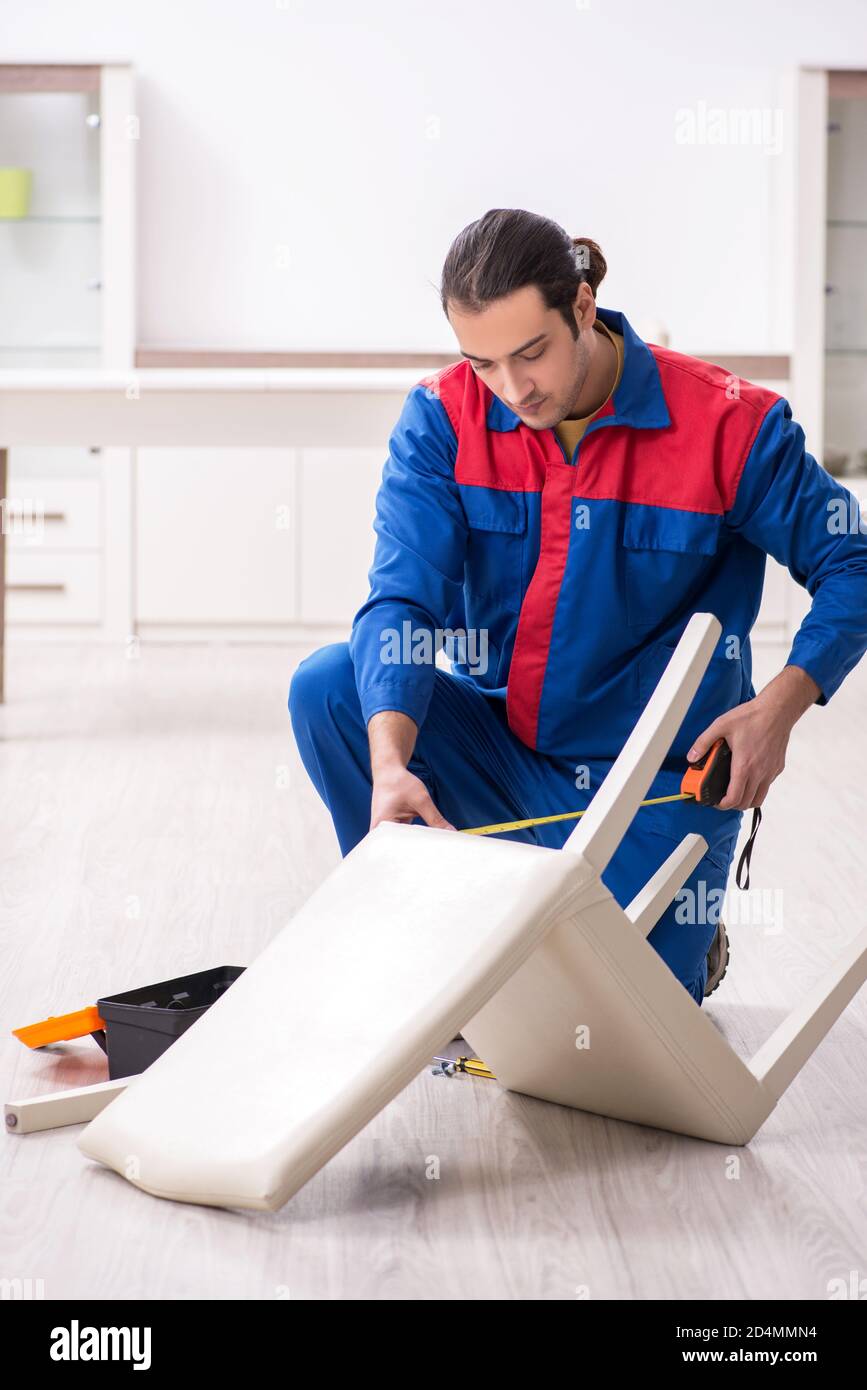 Carpenter measuring wooden chair hi-res stock photography and images ...