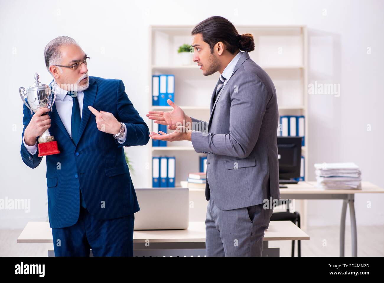 Two employees working in the office Stock Photo - Alamy