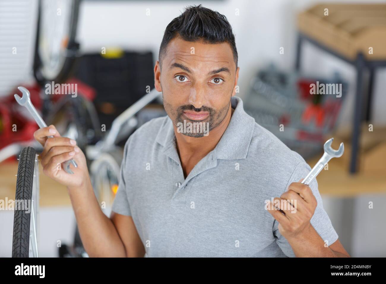 a male repairman showing tools Stock Photo - Alamy