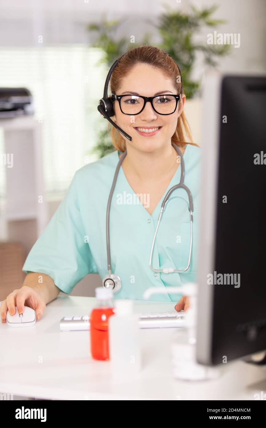 medical secretary typing report on deskop computer Stock Photo - Alamy