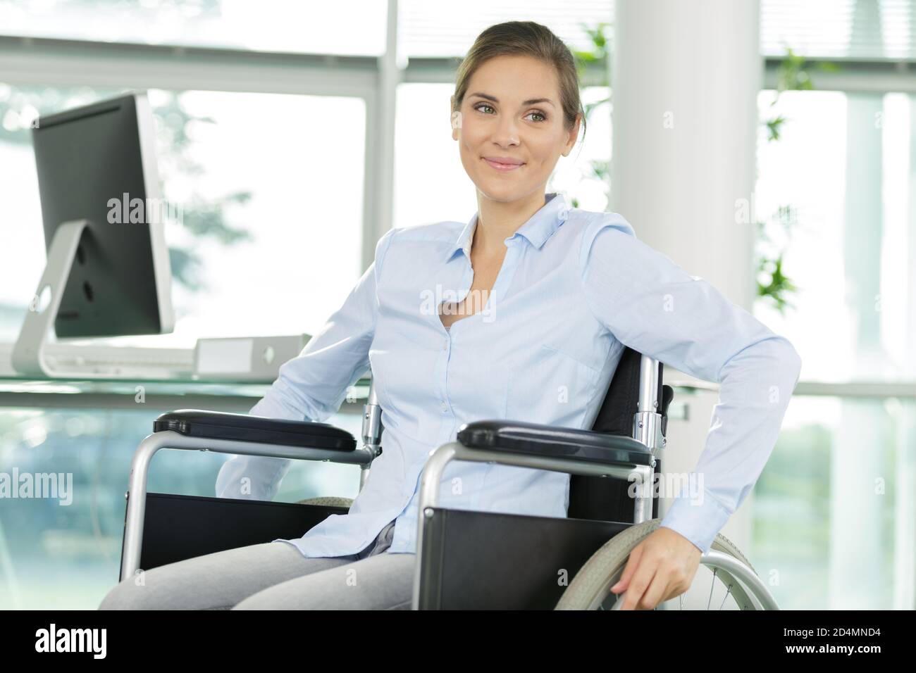 disabled person in the wheelchair works in the office Stock Photo - Alamy