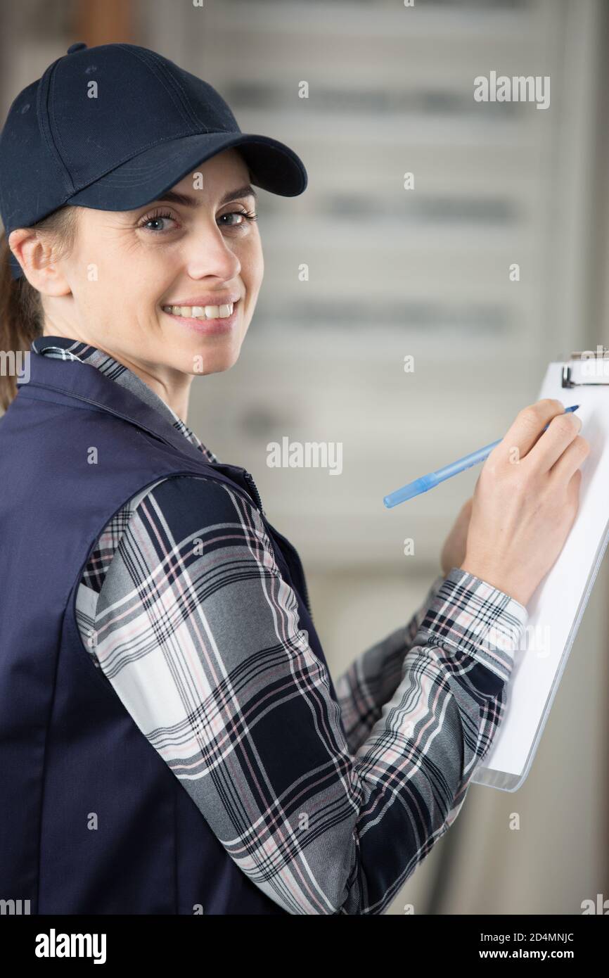 Happy woman checking stuff hi-res stock photography and images - Alamy
