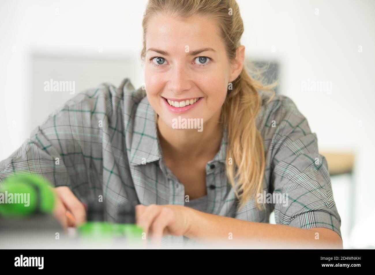 cute female engineer at home working on technology Stock Photo - Alamy