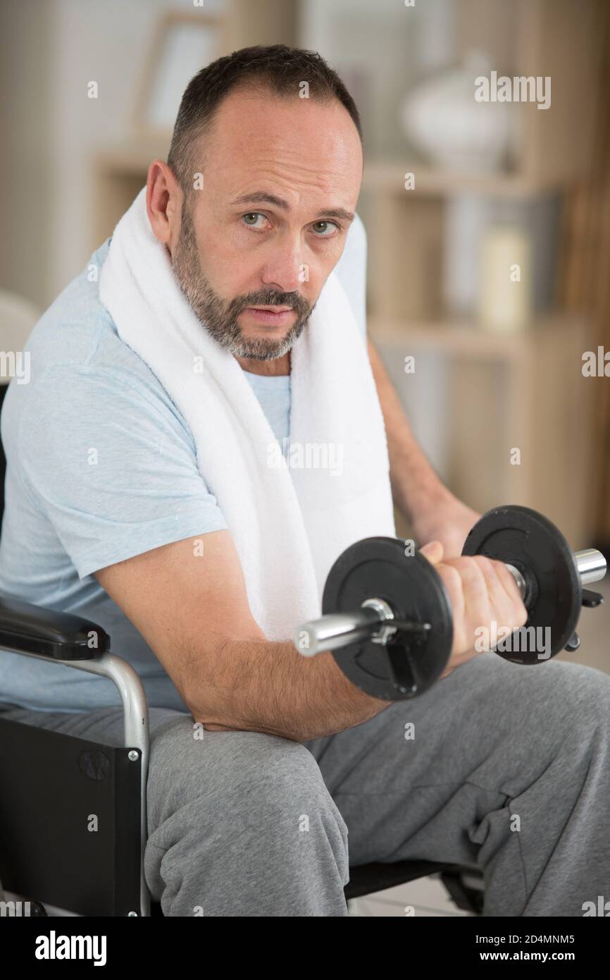handicapped man on wheelchair working out Stock Photo - Alamy