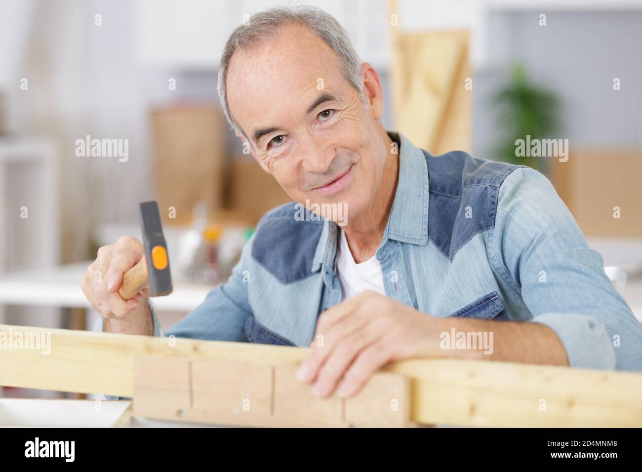 Handyman mature home improvement working hi-res stock photography and ...