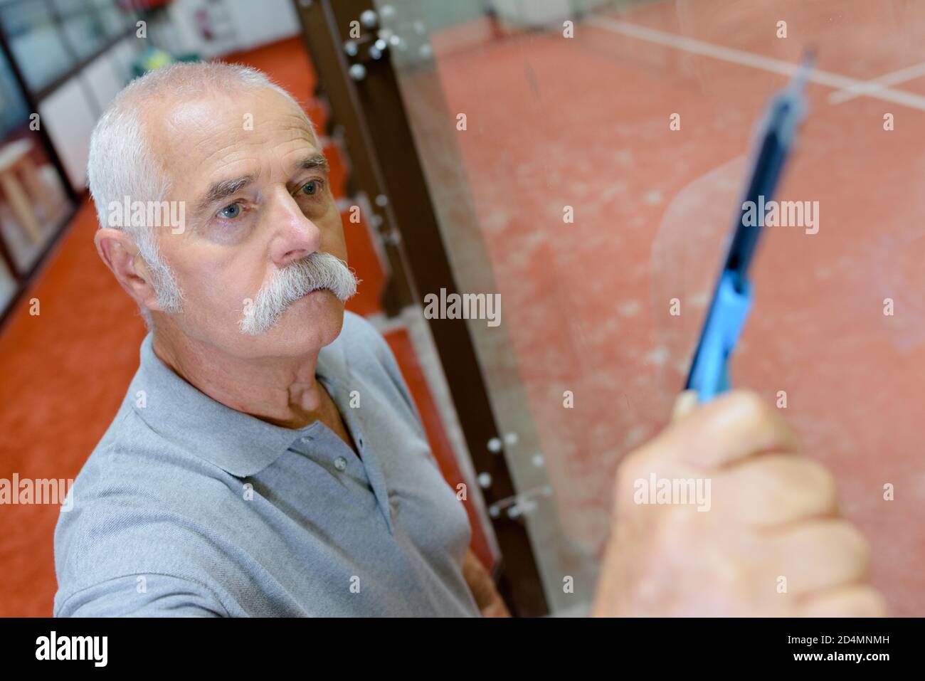 male senior window cleaner at work Stock Photo - Alamy