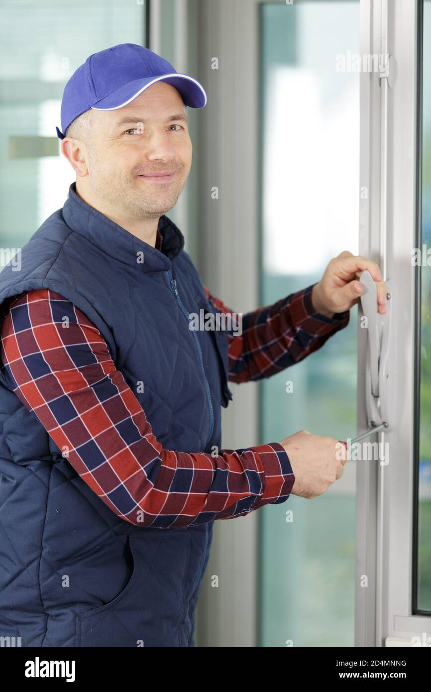 man changing a door handle Stock Photo - Alamy