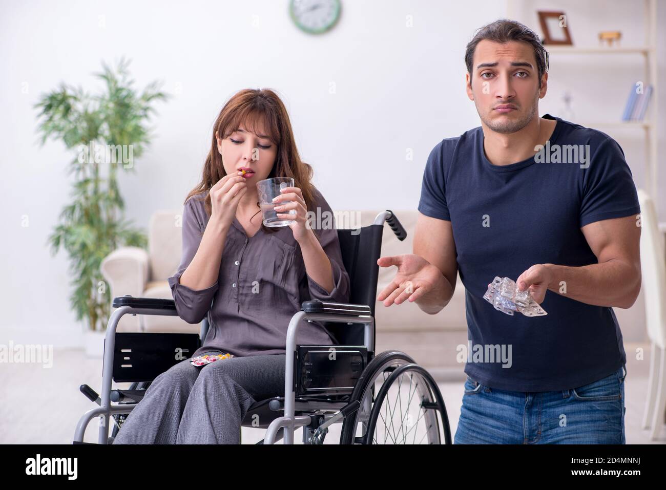 Disabled wife and husband at home Stock Photo - Alamy